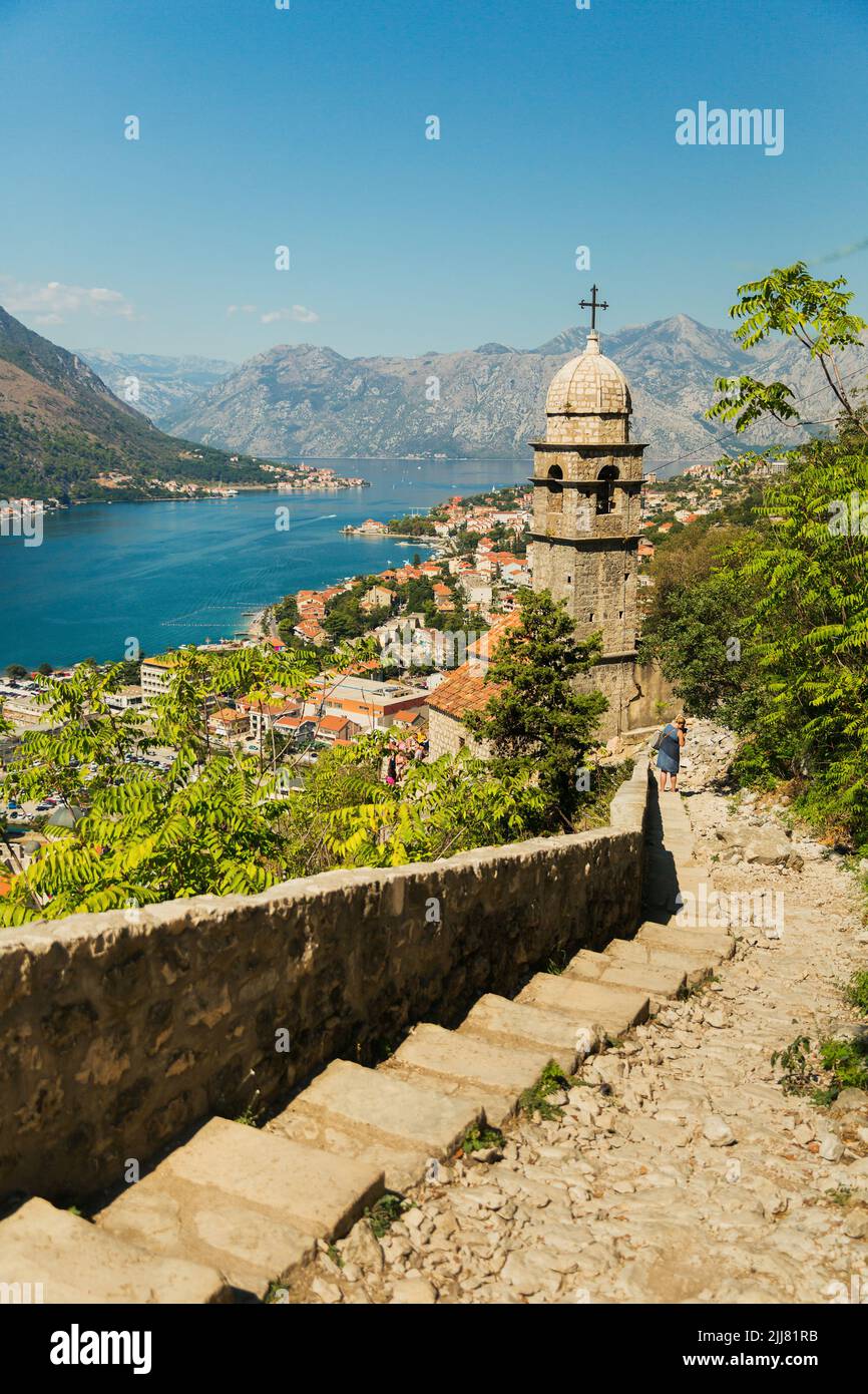 View on Church, ancient walls, mountains and sea in Kotor old town ...