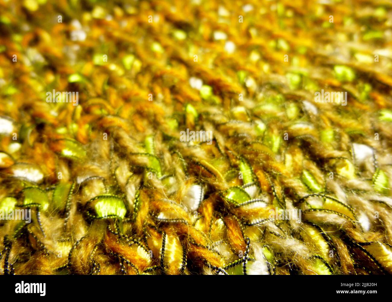 Knitted fabric close-up. Textured fantasy yarn Stock Photo - Alamy