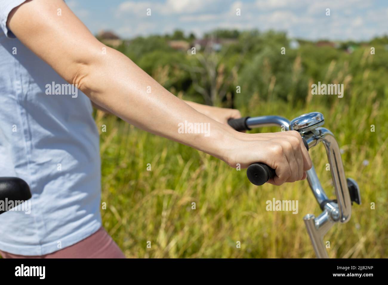 Girl pushing a bike hi-res stock photography and images - Alamy
