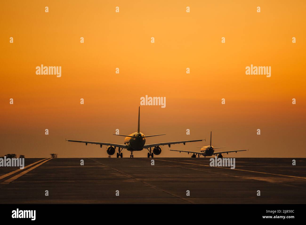 Passenger airplane take off from airport runway against the backdrop of ...