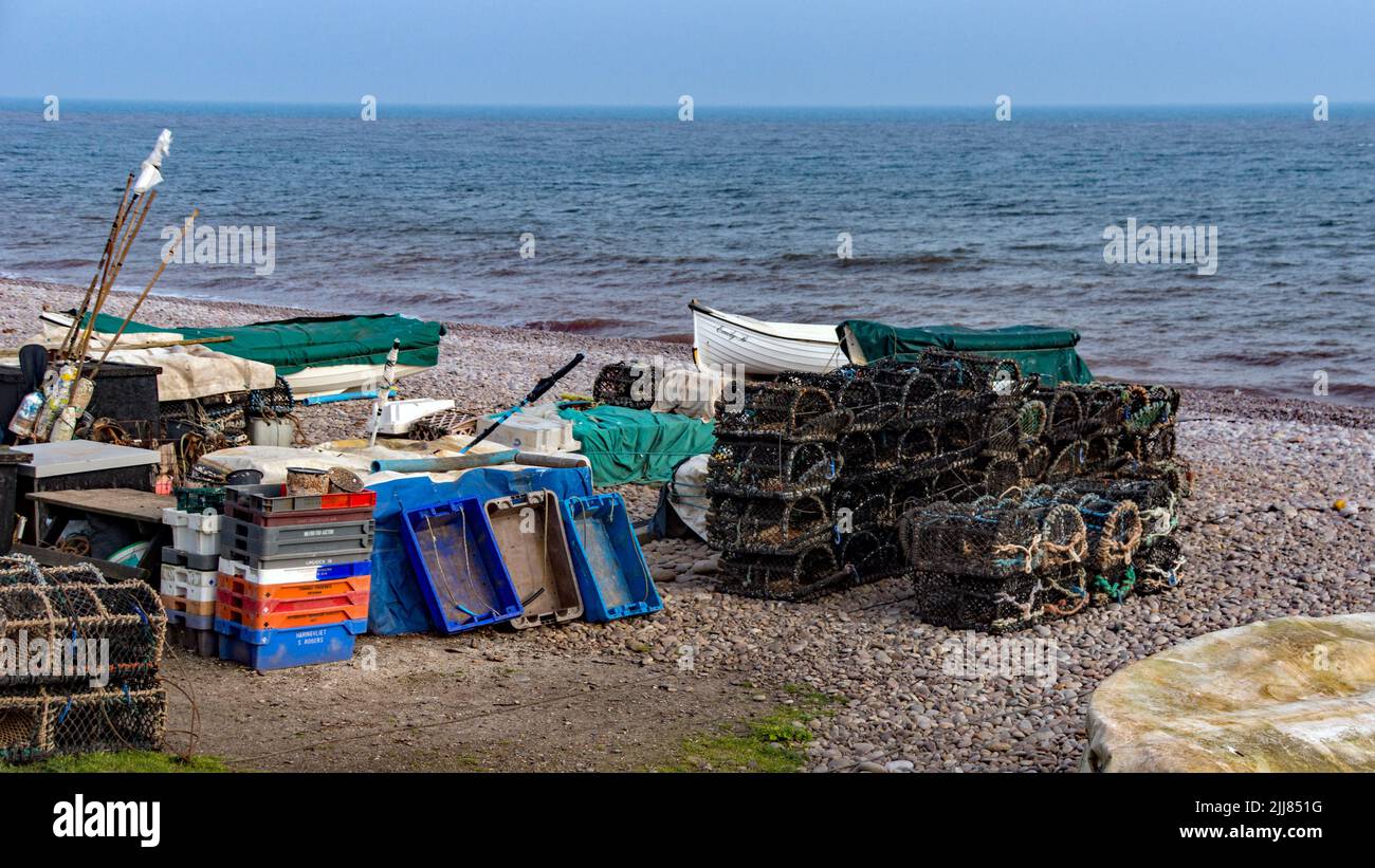 Fishing gear stored on the stone beach at Budleigh Salterton in Devon ...