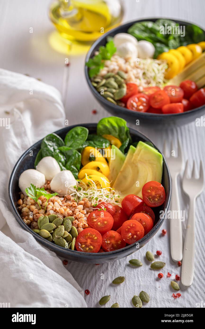 Healthy and fresh salad as a balanced meal for diet. Healthy bowls on a ...