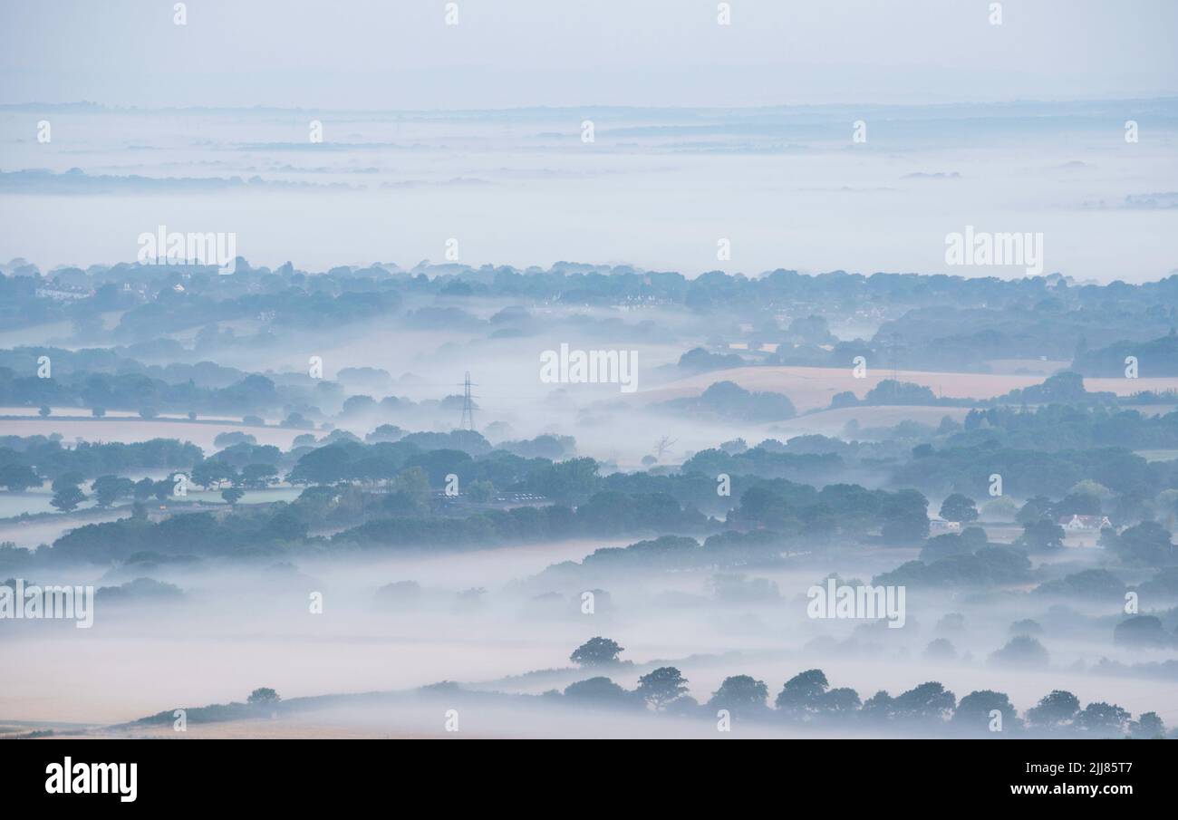 Stunning landscape image of layers of mist rolling over South Downs ...