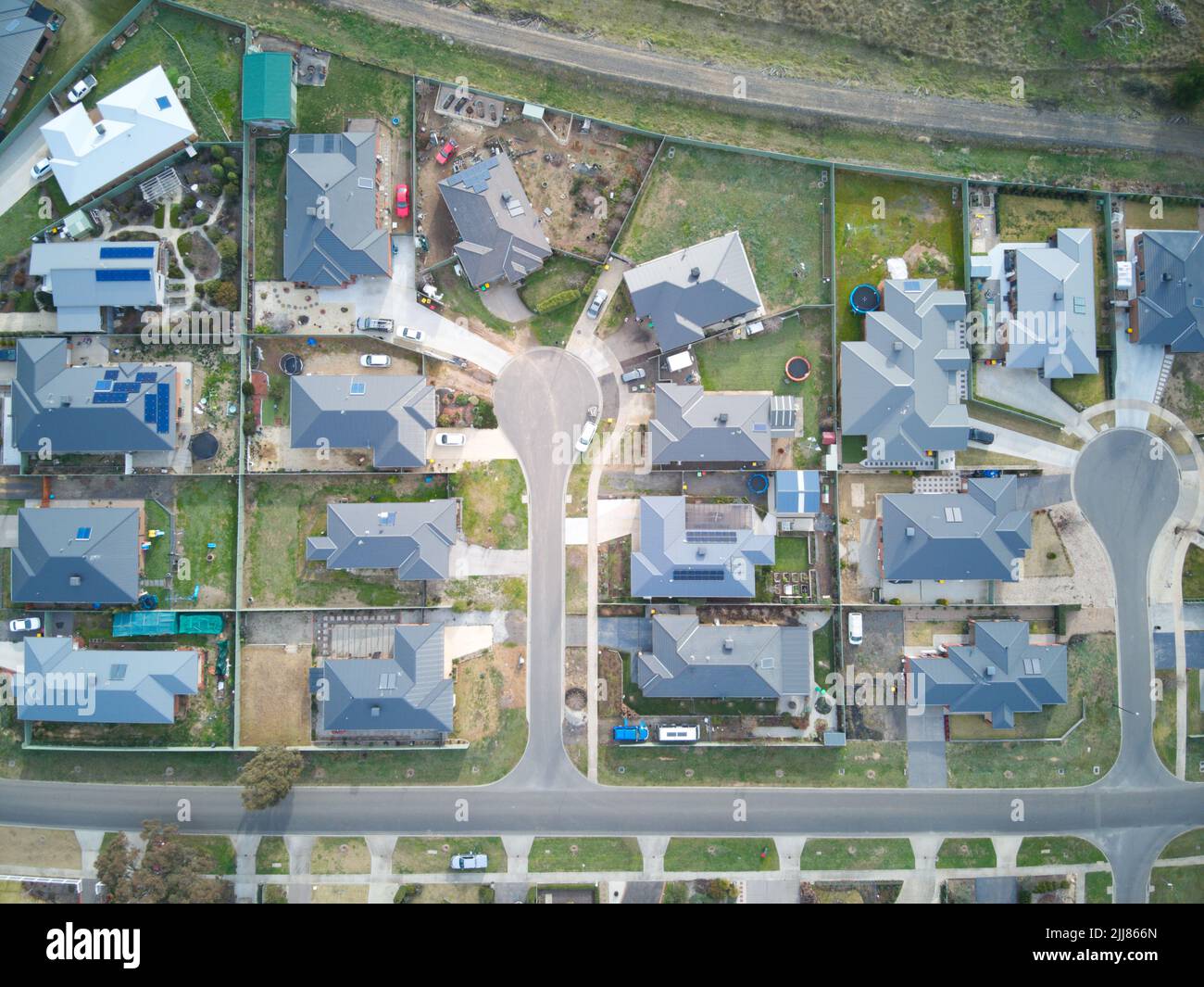 Houses from above, urban street and residential development, with roads ...