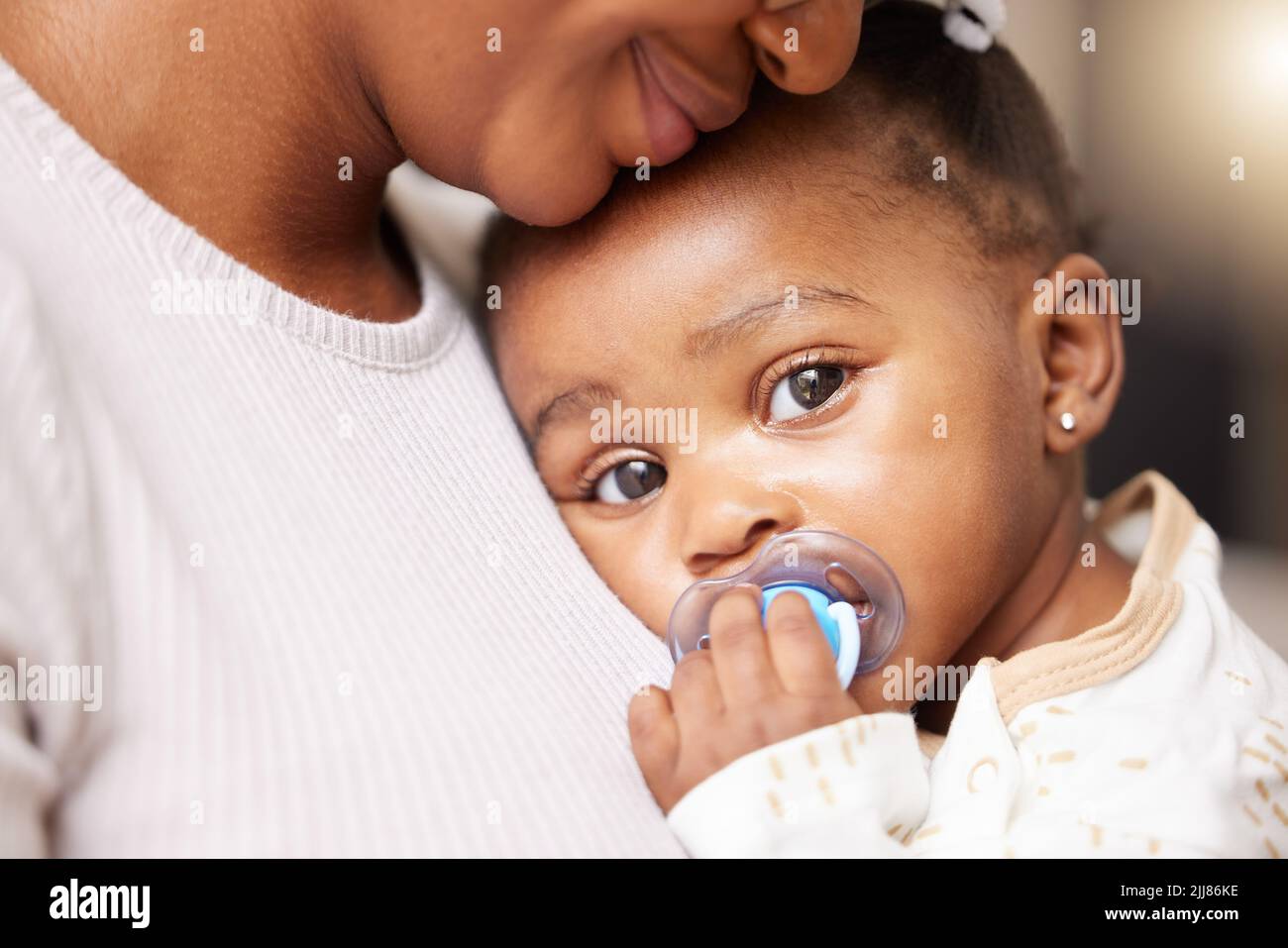 Moms love feels like a world of comfort. Portrait of an adorable baby ...
