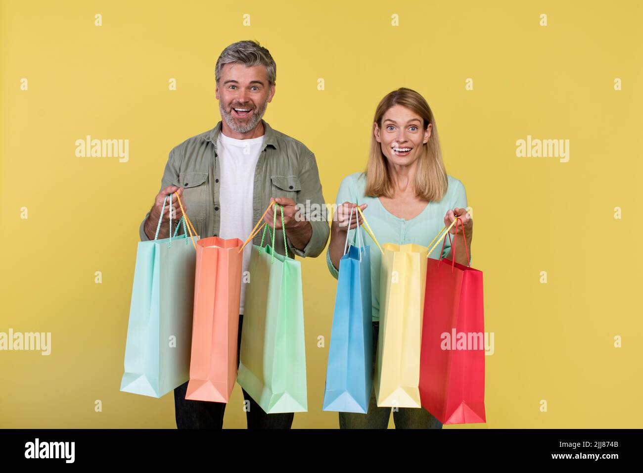 Big sale and shopping with pleasure. Excited middle aged spouses ...