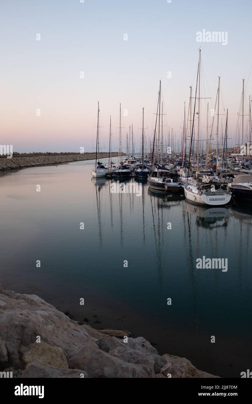 Yachts and sailing boats are seen at a seaside port Stock Photo - Alamy