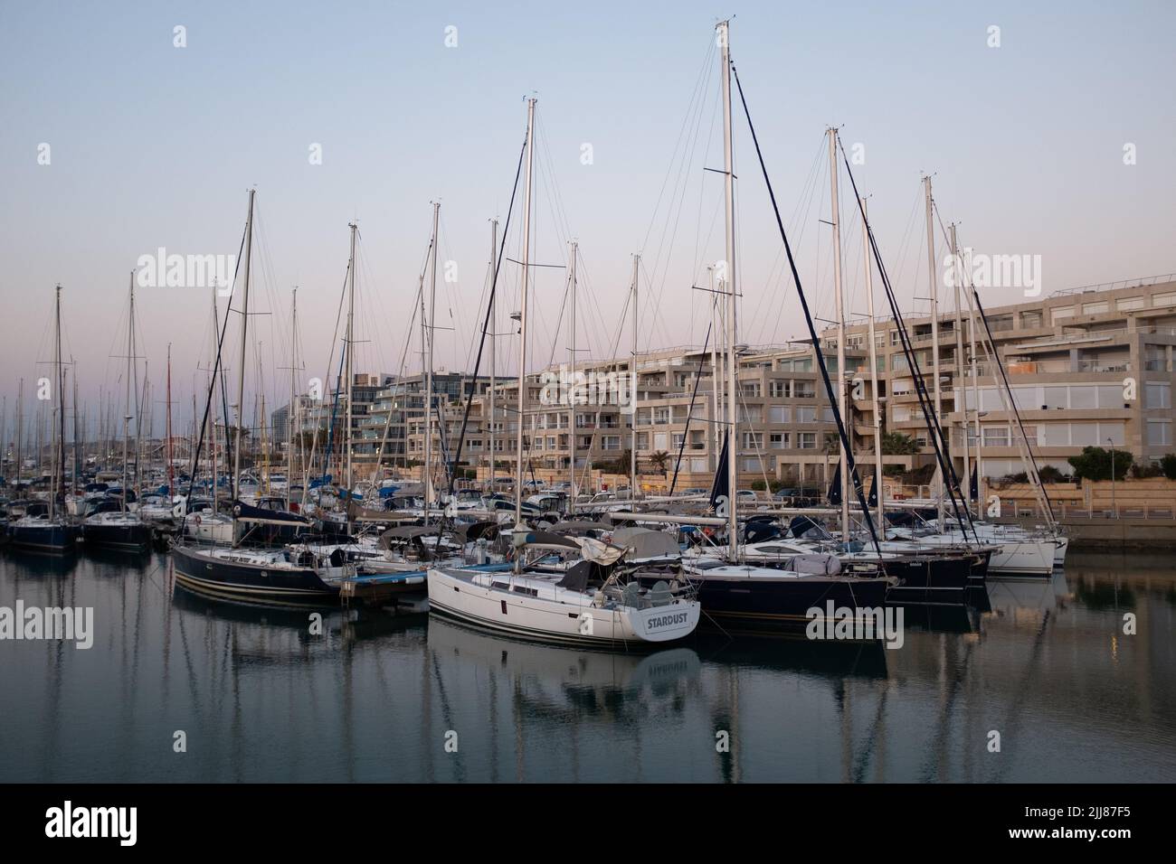 Yachts and sailing boats are seen at a seaside port Stock Photo - Alamy