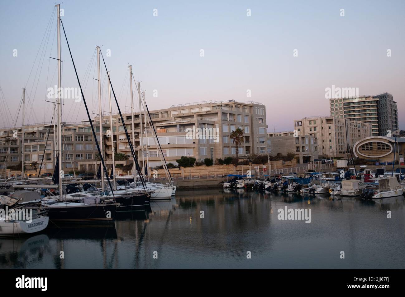 Yachts and sailing boats are seen at a seaside port Stock Photo - Alamy