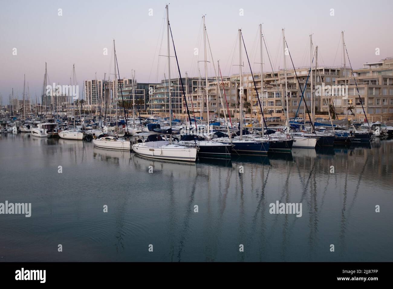 Yachts and sailing boats are seen at a seaside port Stock Photo - Alamy