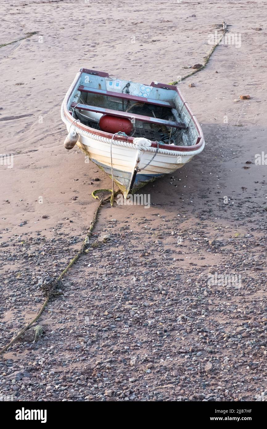 A vertical shot of a boat parked on a sandy beach Stock Photo - Alamy