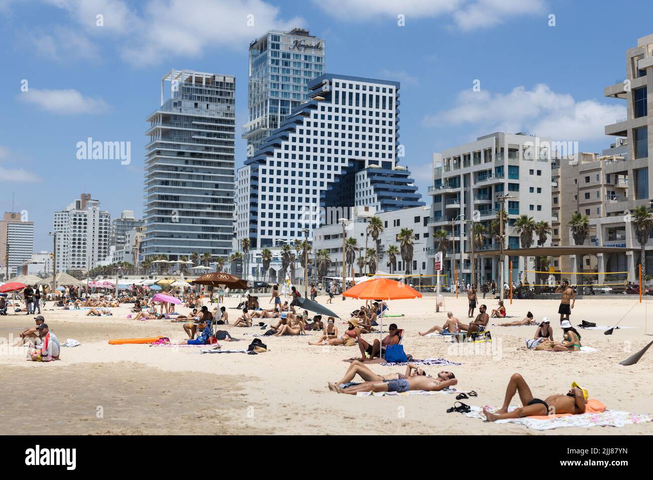 People sunbath on the beach in Tel Aviv Stock Photo - Alamy