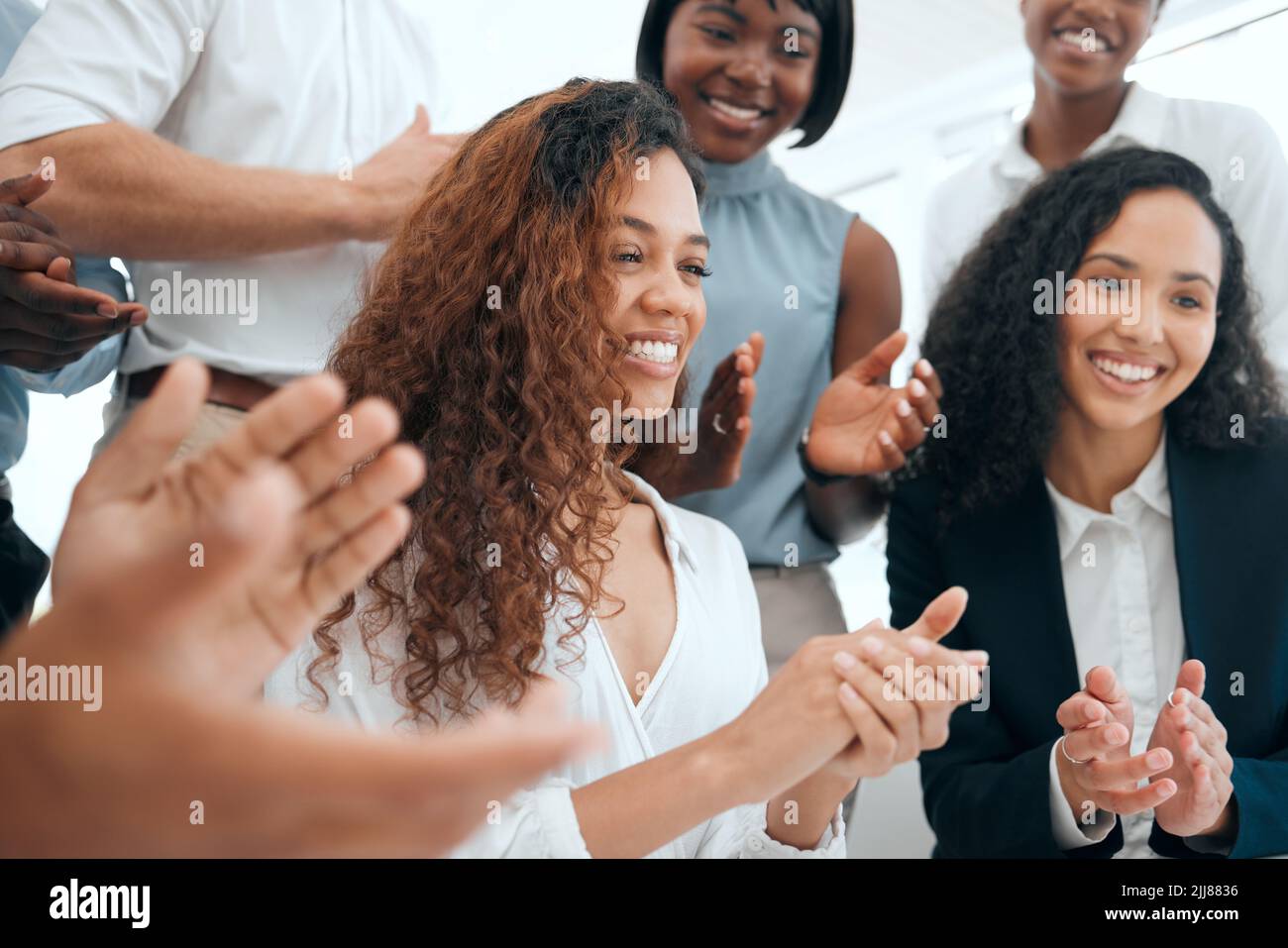 Every achievement deserves an applause. a group of businesspeople ...