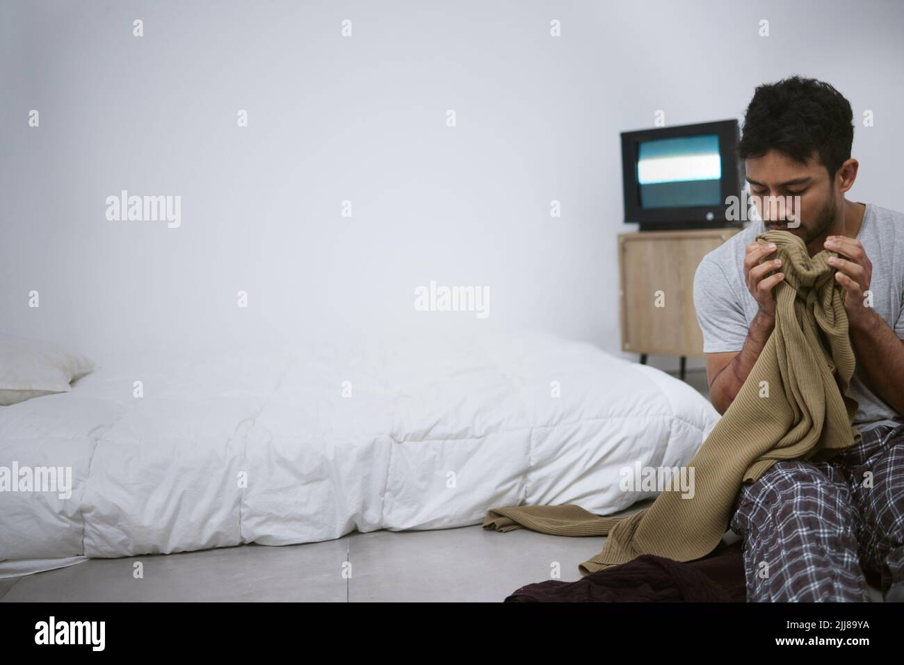 My dark days made me stronger. a scared male sitting in a mental asylum ...