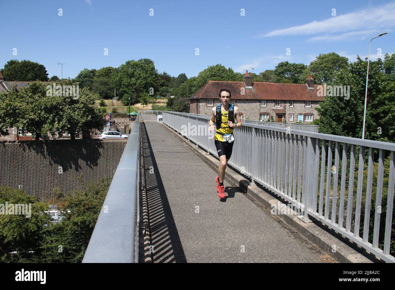 male runner crossing a road bridge Stock Photo - Alamy