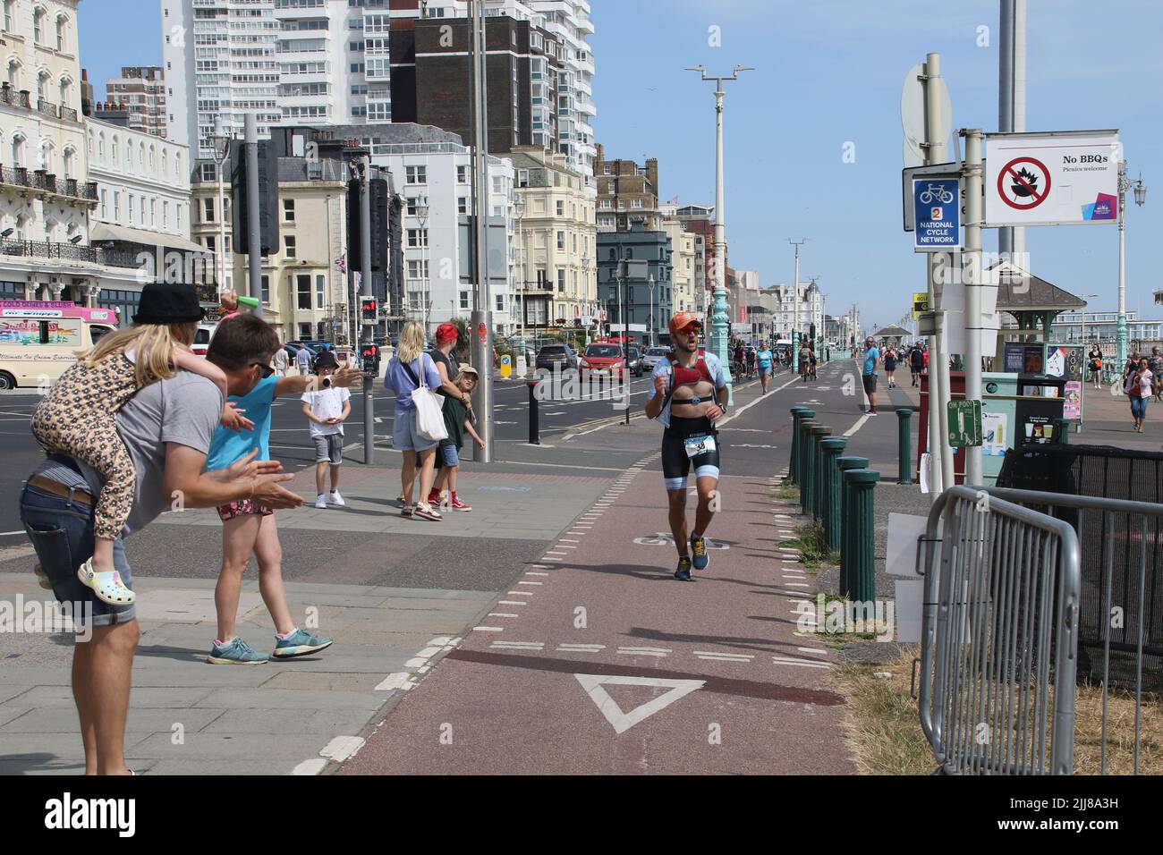 runner nearing finish line on Brighton seafront Stock Photo - Alamy