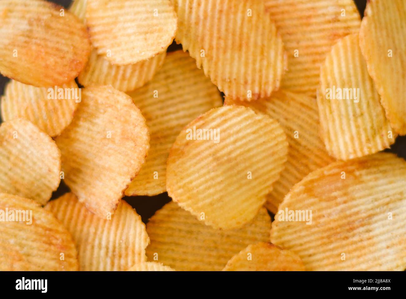 chips food background wavy ridged potato crisp mix Stock Photo - Alamy