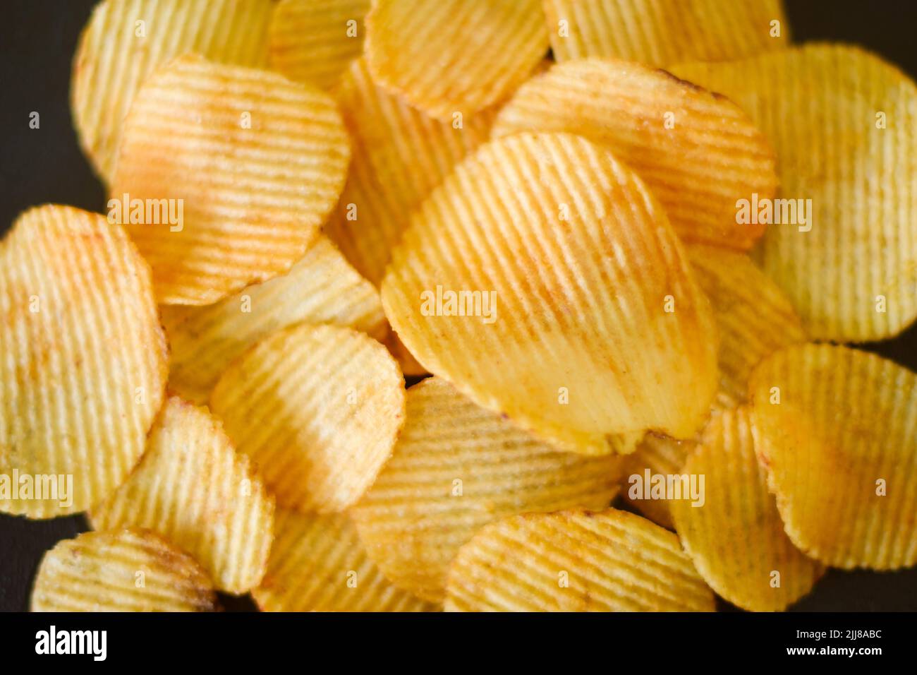 fast food ridged chips recipe fried potato slices Stock Photo - Alamy