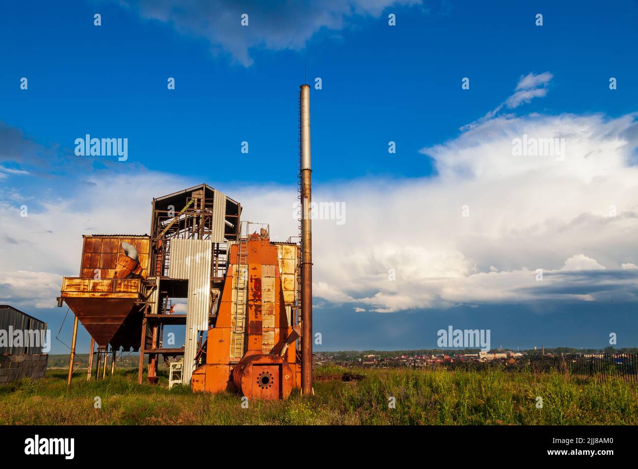 Old abandoned agricultural building with rusty iron walls. Soviet and ...