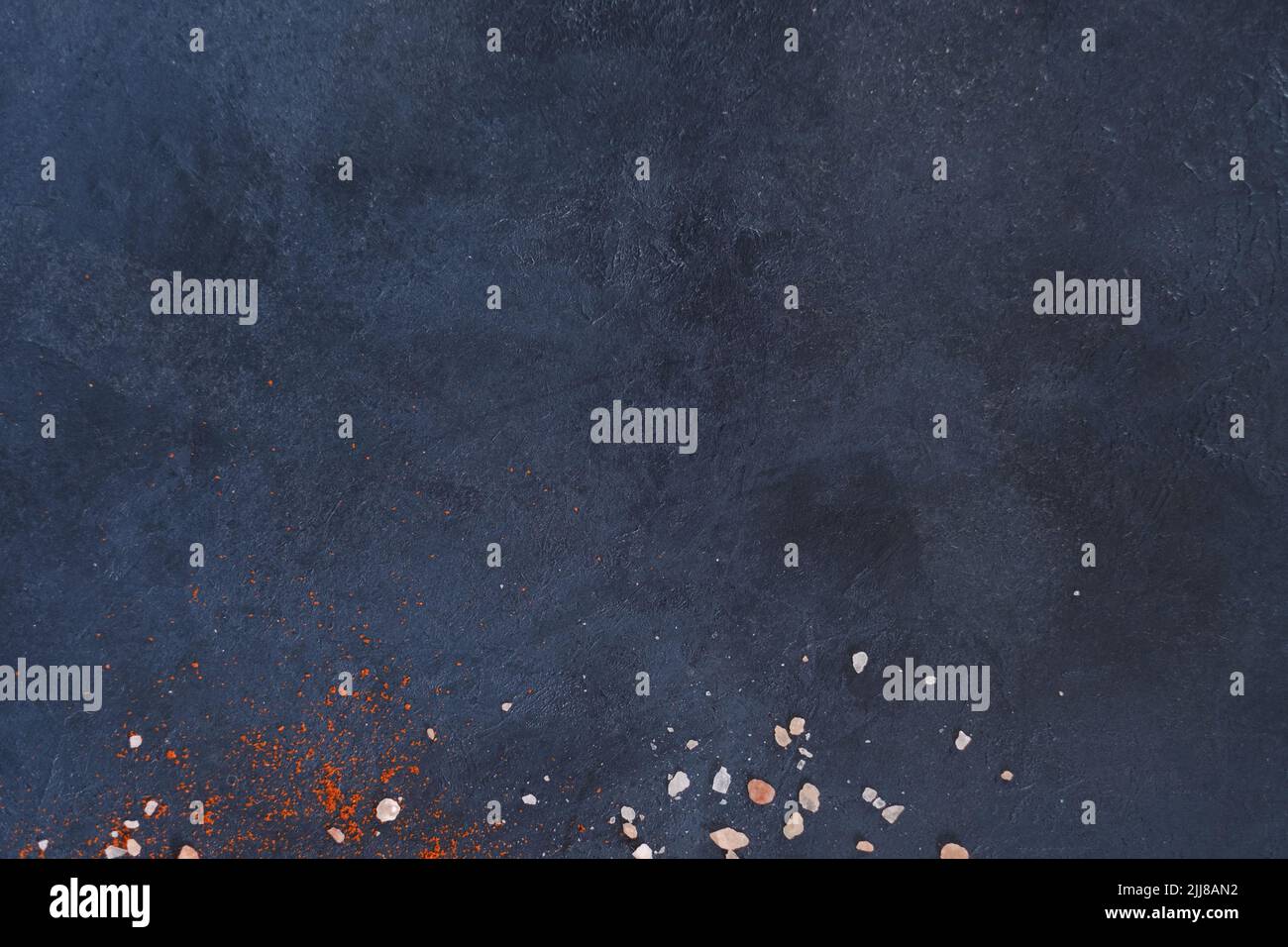 dark background flecks salt red pepper food spices Stock Photo - Alamy