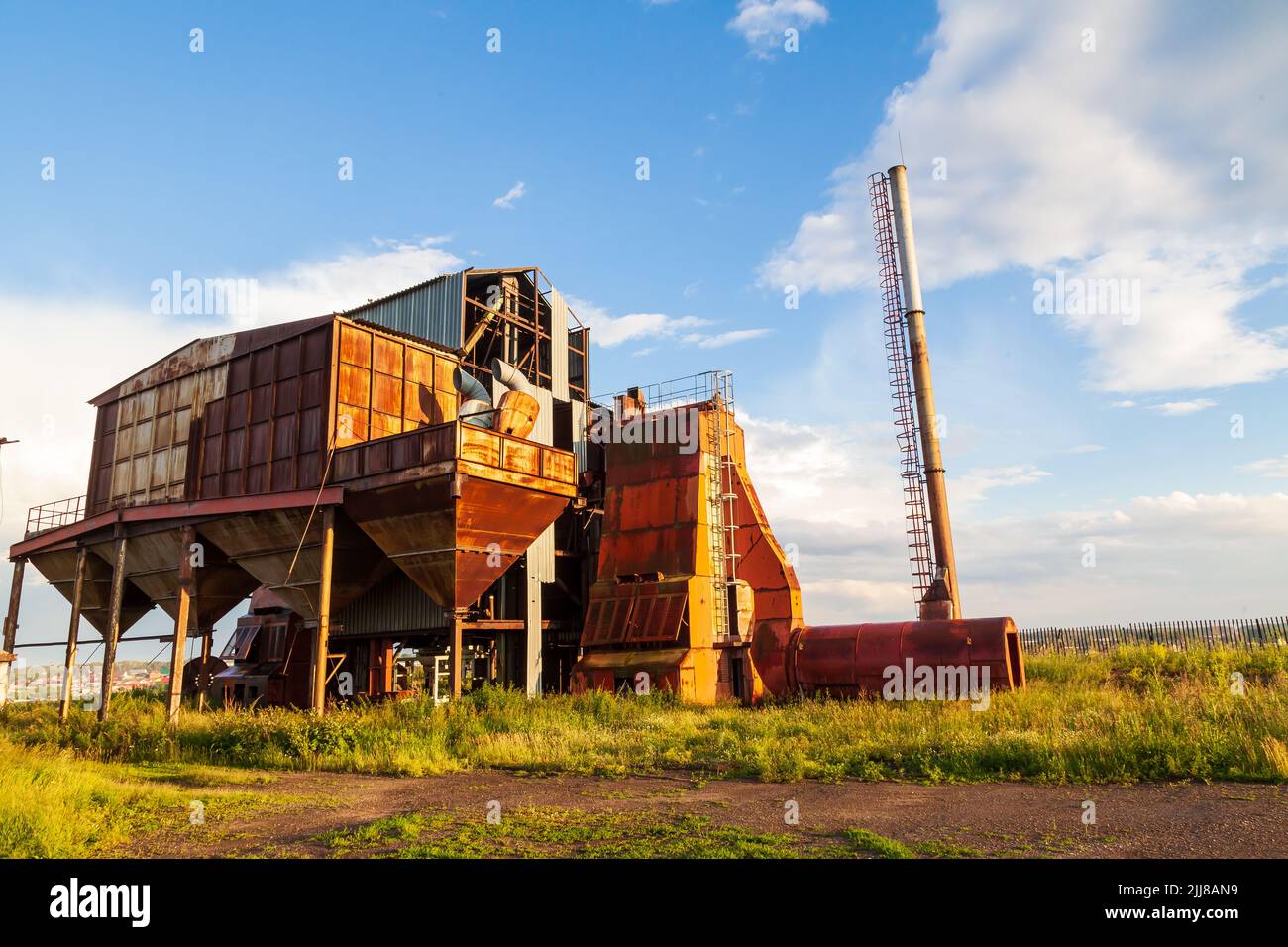 Old abandoned agricultural building with rusty iron walls. Soviet and ...