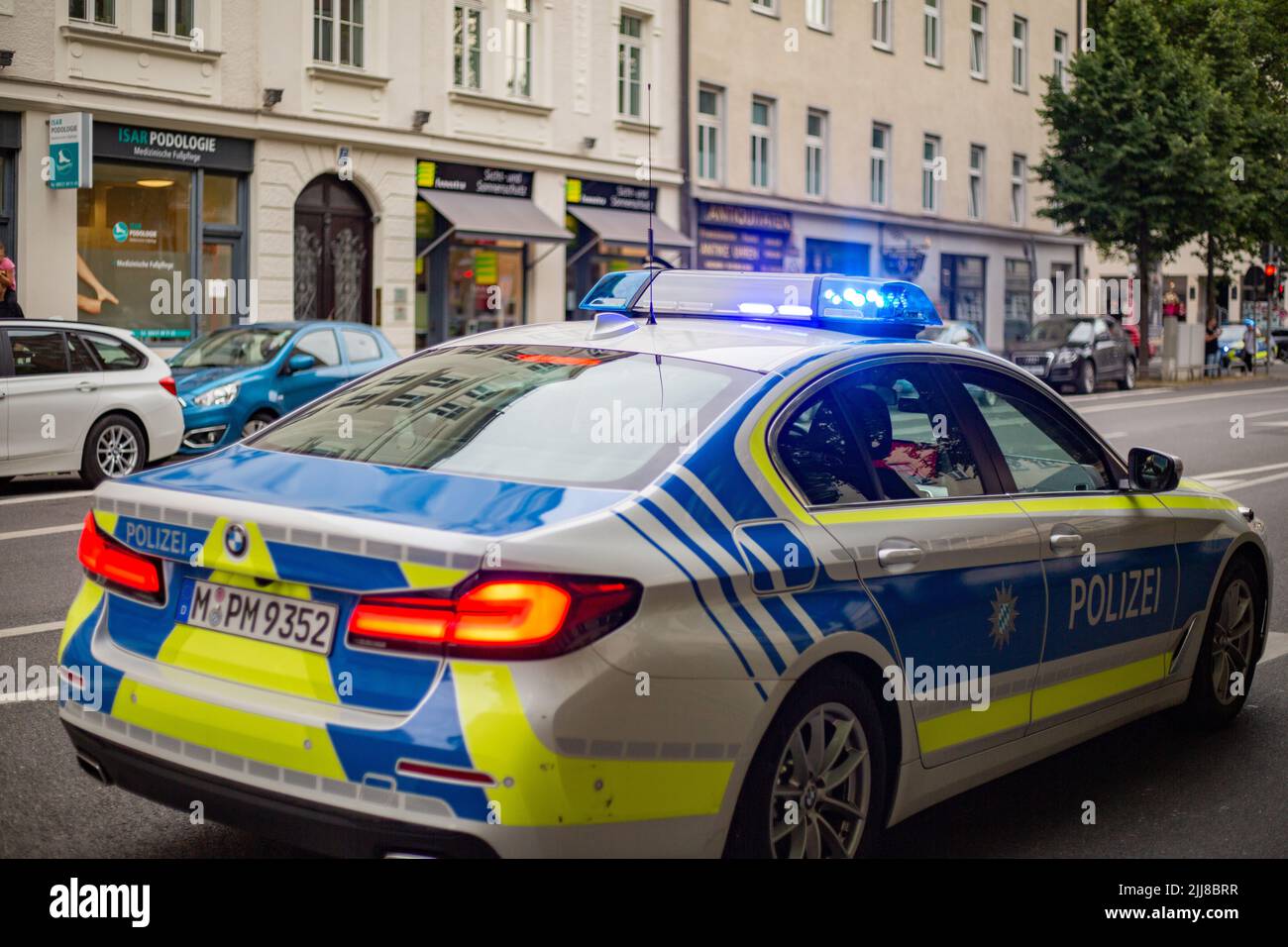 Police car with bluelight in operation in Munich, Germany. (Photo by ...