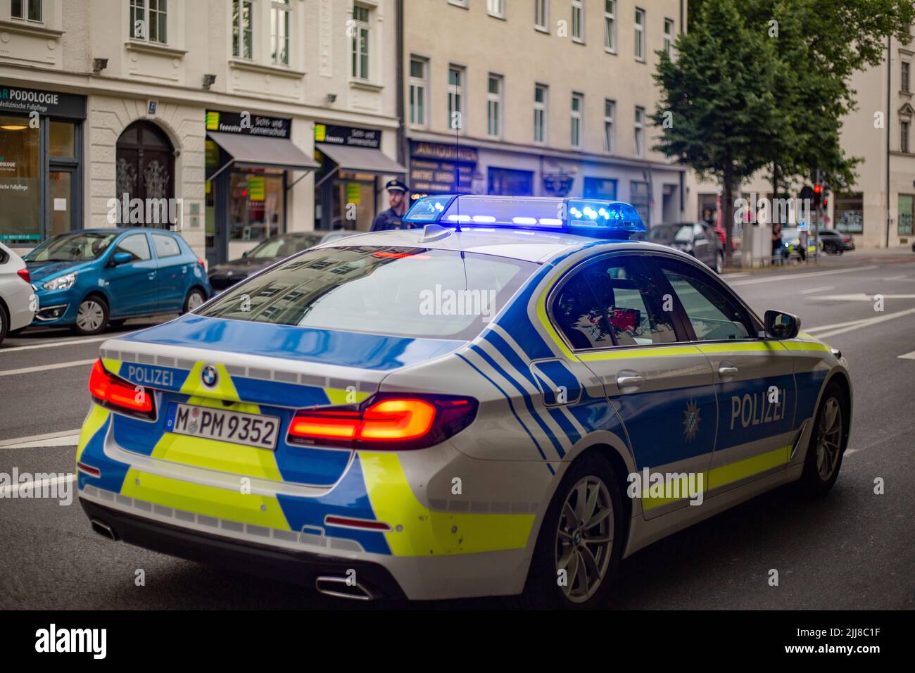Police car with bluelight in operation in Munich, Germany. (Photo by ...