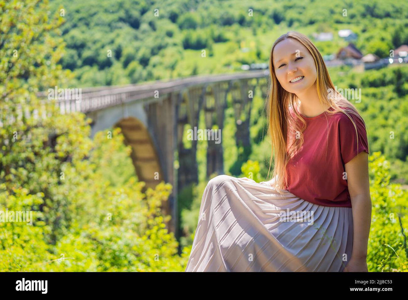 Montenegro. Woman tourist in background of Dzhurdzhevich Bridge Over ...