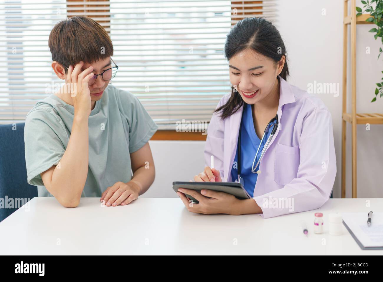 Healthcare concept, Male patient feeling headache and talk with doctor ...