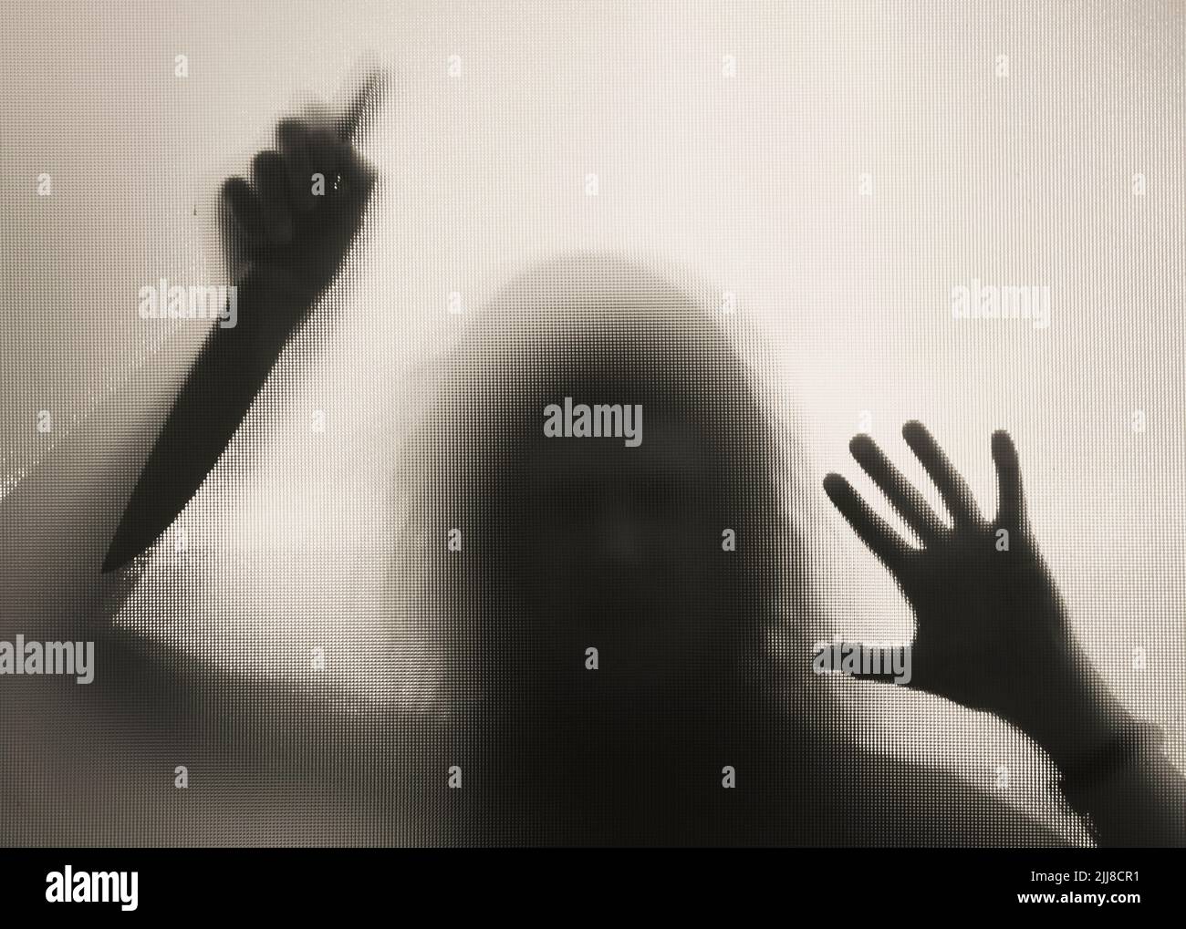 Horror, halloween background - Shadowy figure behind glass holding a ...