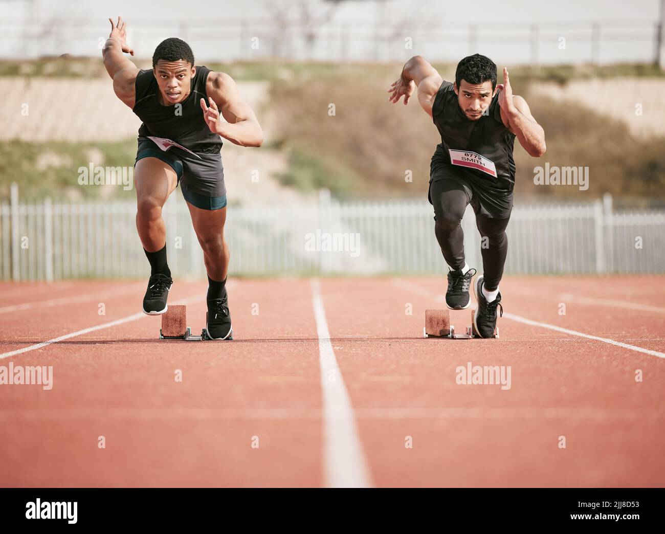 Whos got the pace. Full length shot of two handsome young male athletes ...