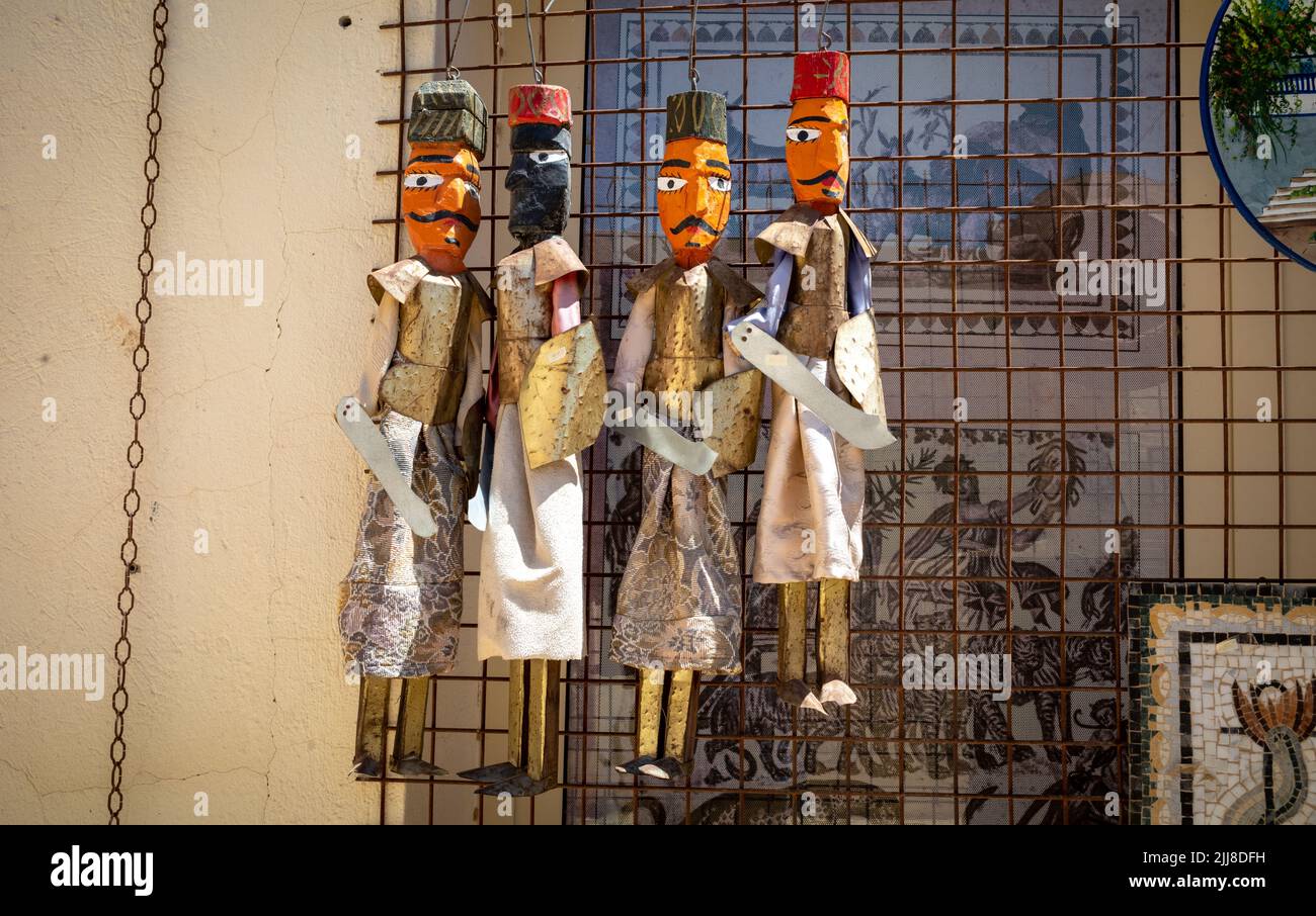 Traditional puppets and Roman-style mosiacs for sale at the souvenir ...