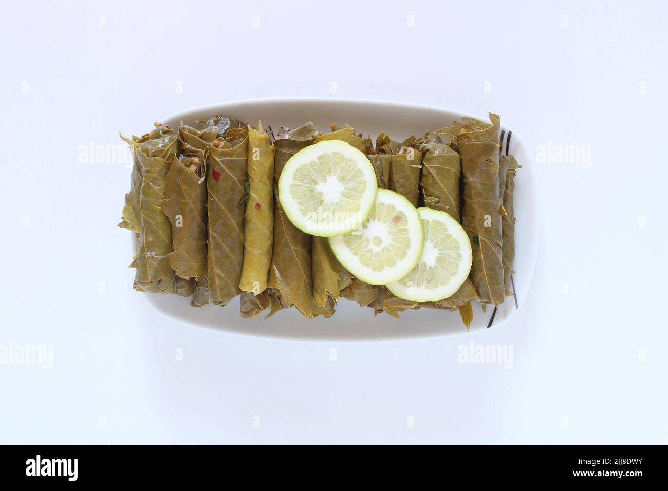 Turkish or Greek cuisine food Yaprak Sarma (Wrap stuffed) with lemon ...