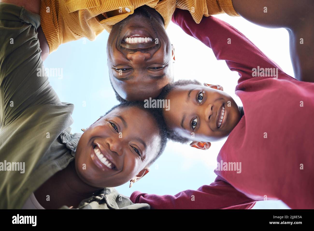 Were stuck together like glue. a young couple and their son standing ...