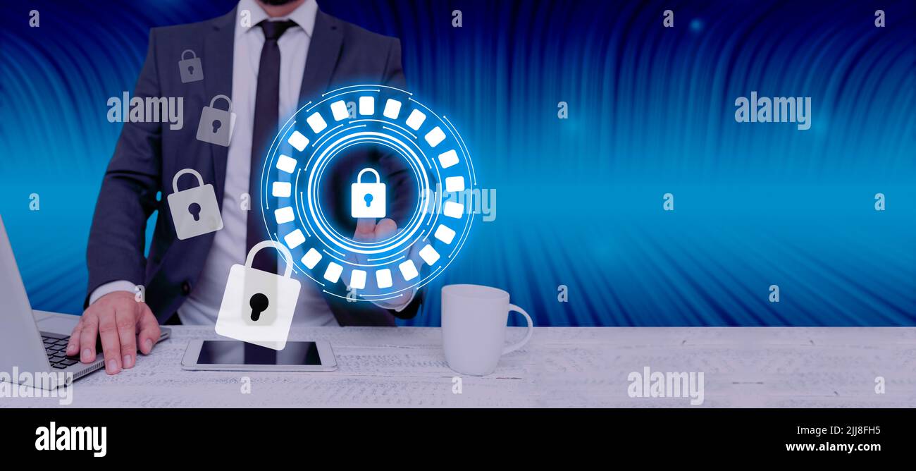 Businessman With Laptop And Tablet Pointing On Lock Symbols For Data ...