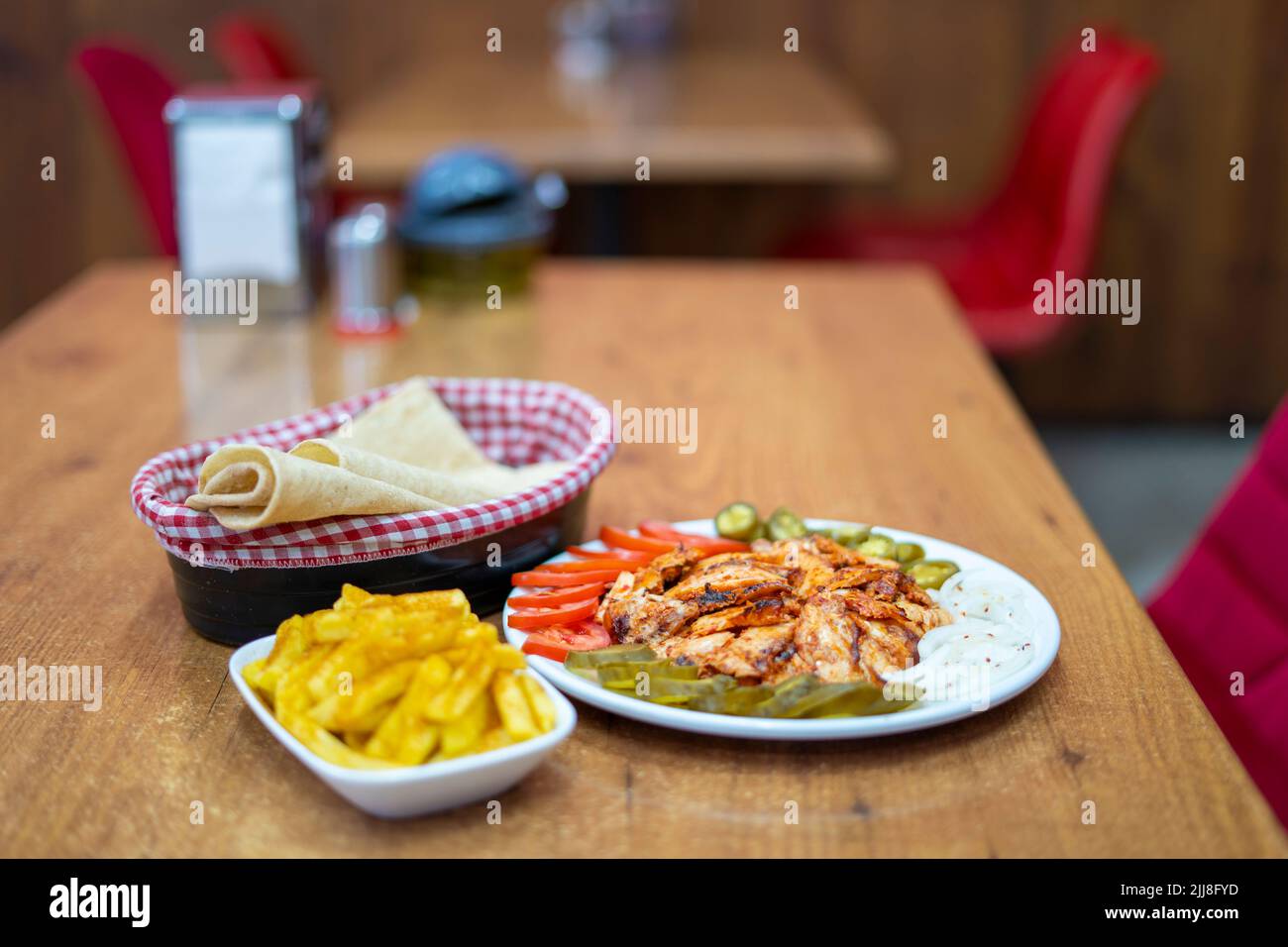 Chicken döner meat plate in a Restaurant Stock Photo - Alamy