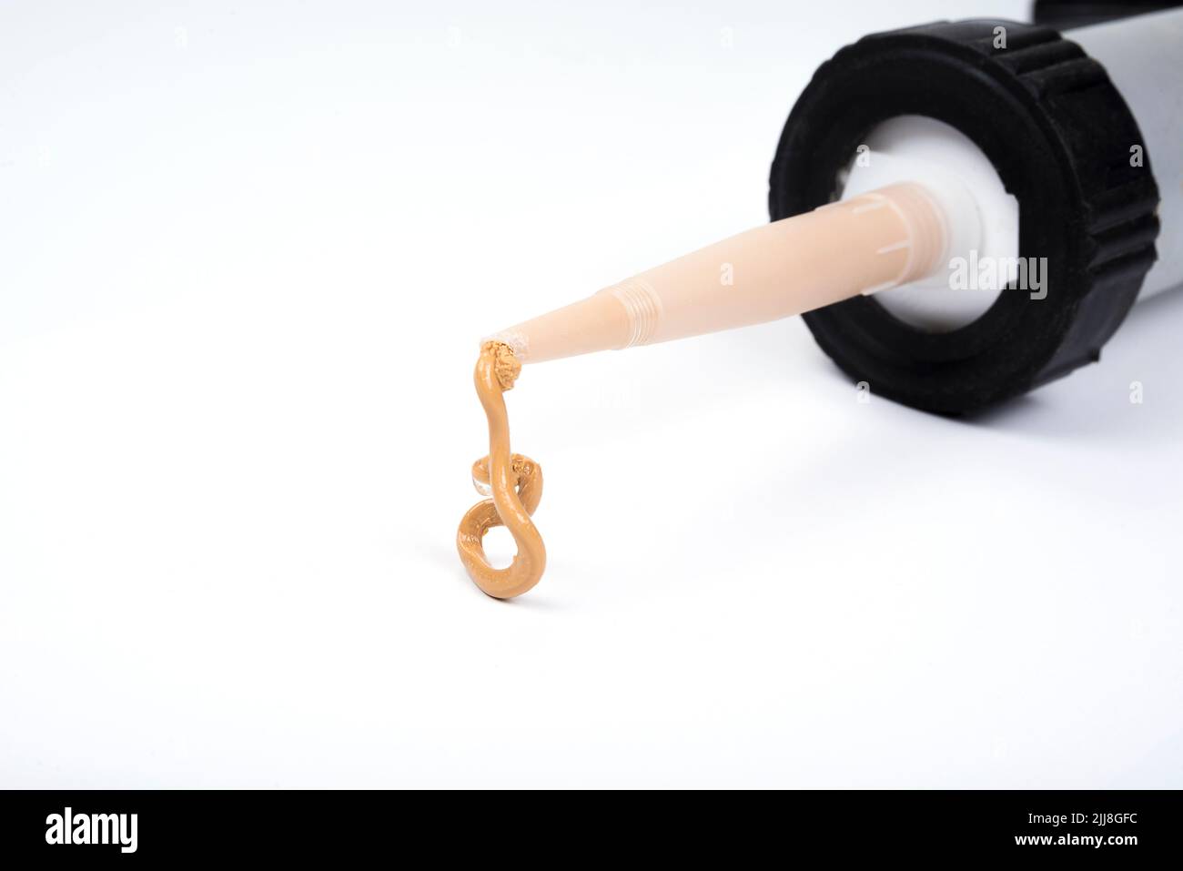 Color sanitary silicone on a white background Stock Photo - Alamy