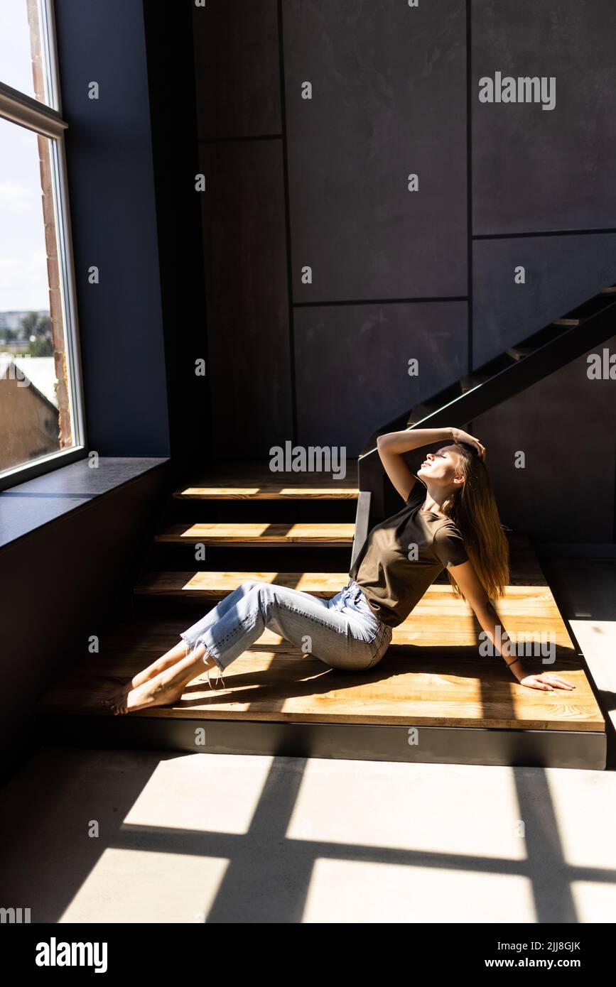 Portrait young woman relaxing stairs hi-res stock photography and ...