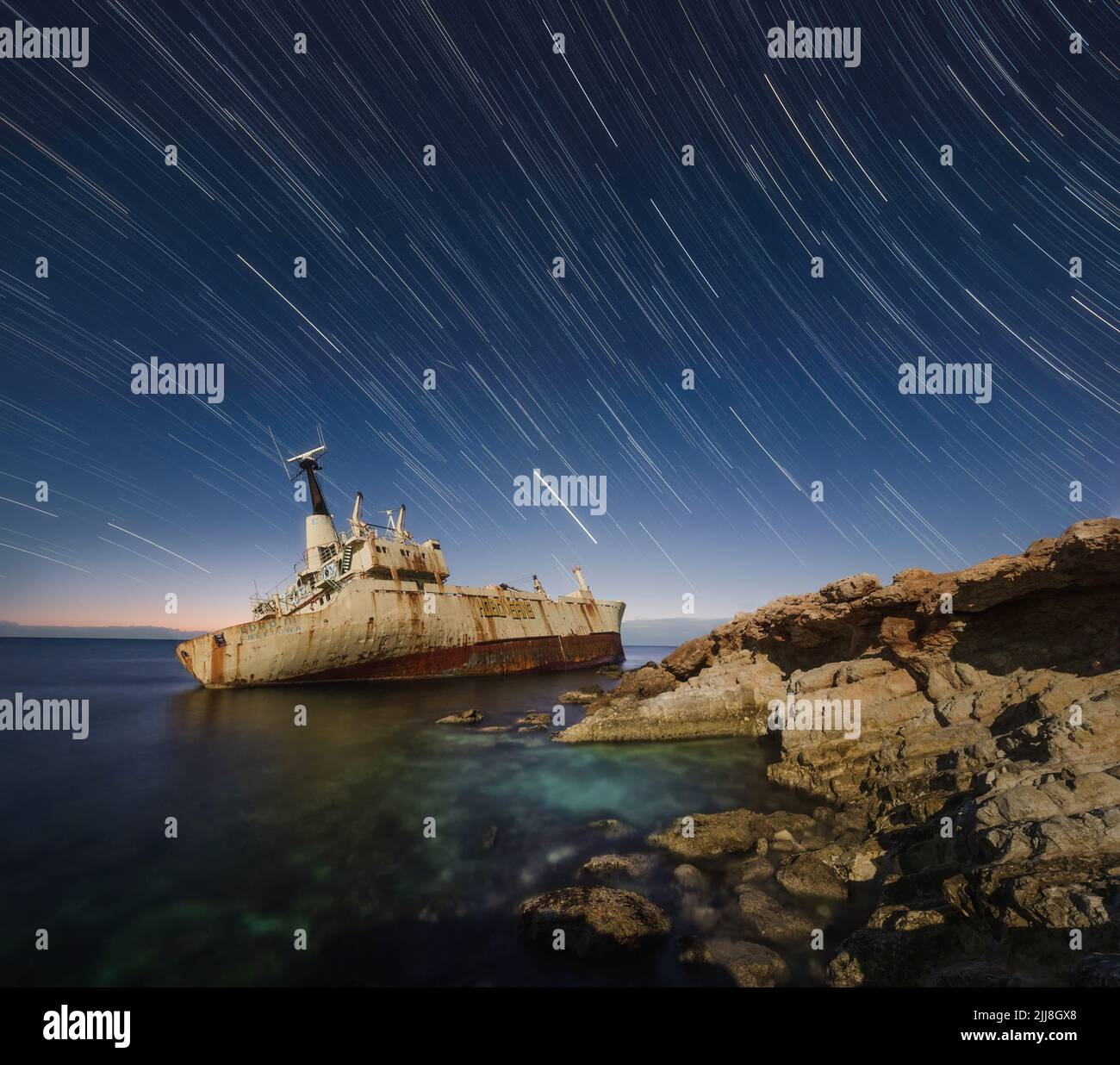 A rustic ship at night in the seashore Stock Photo - Alamy