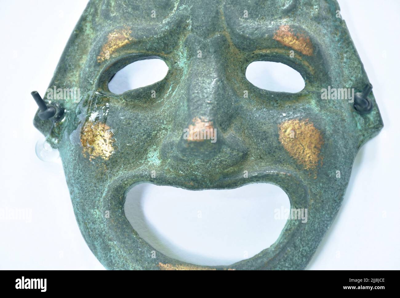 iron human face mask smiling with tear drop on white background Stock ...