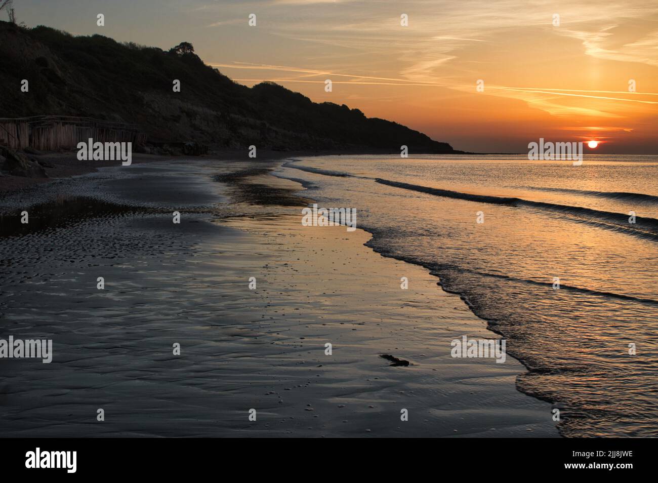 An aesthetic calm beach view during sunset in White Cliff Bay, Isle of ...
