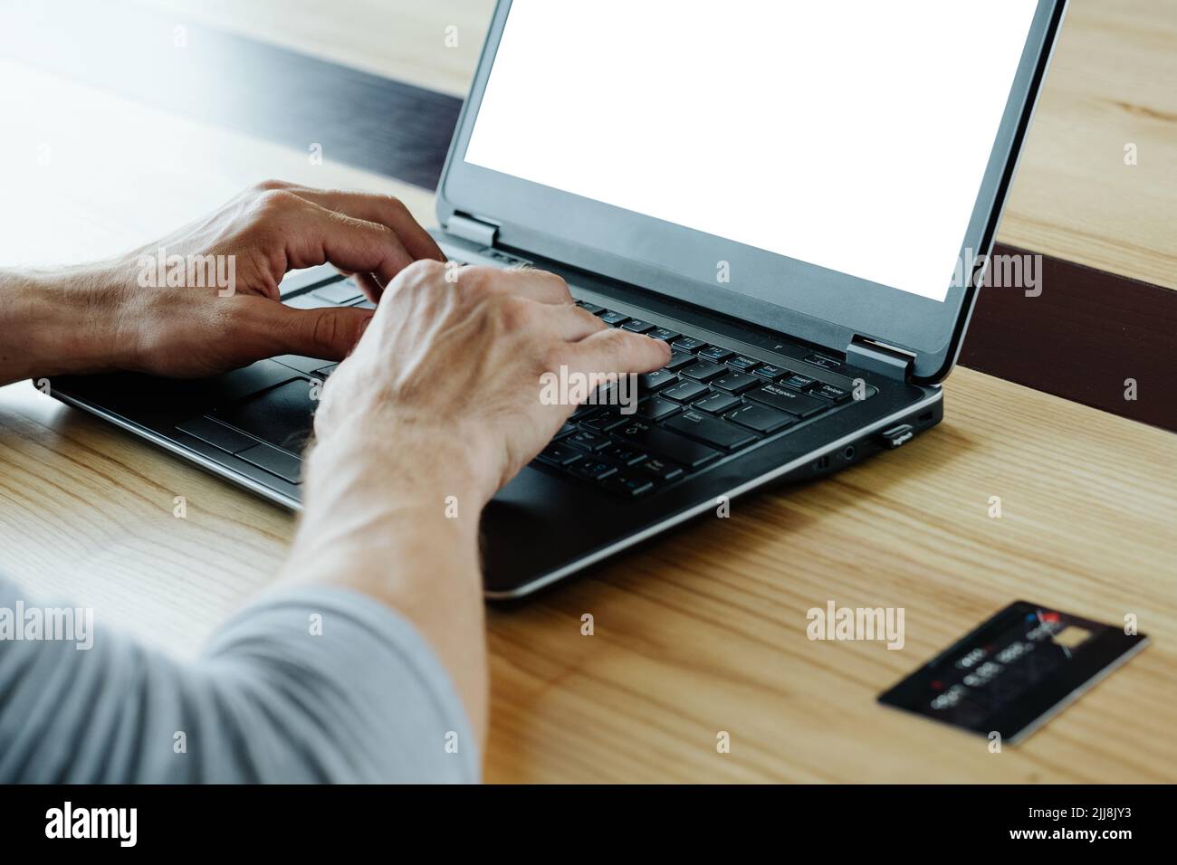 make money online man typing laptop bank card Stock Photo - Alamy
