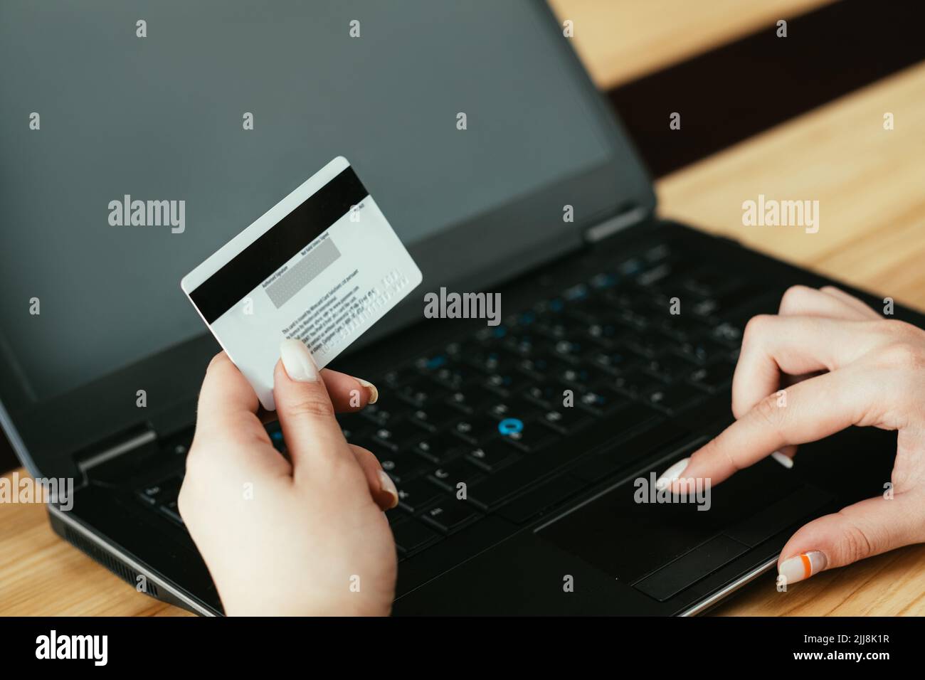 Debit card laptop woman hi-res stock photography and images - Alamy