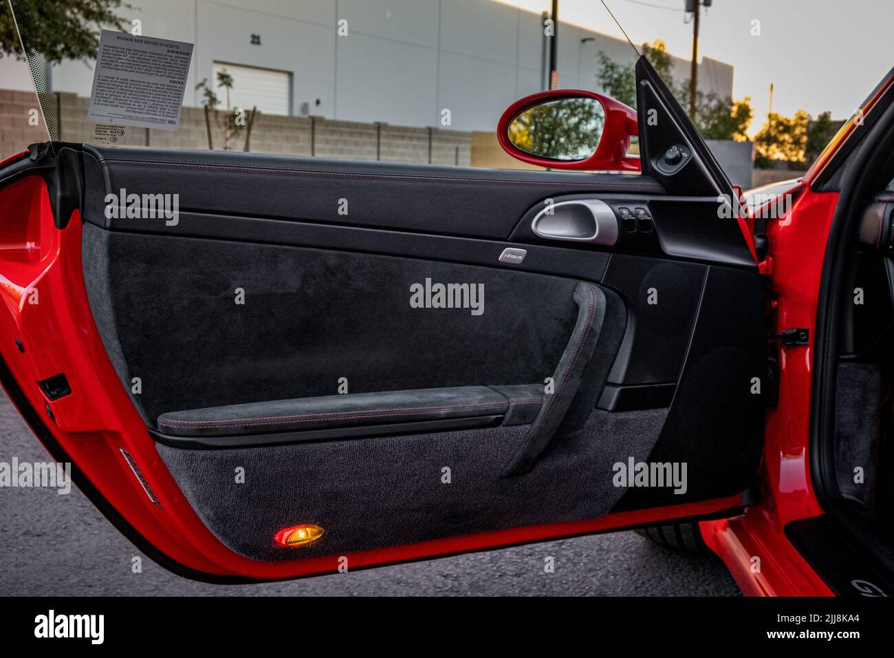 The close-up view of a Red 2008 Porsche 911 GT3 car opened door Stock ...