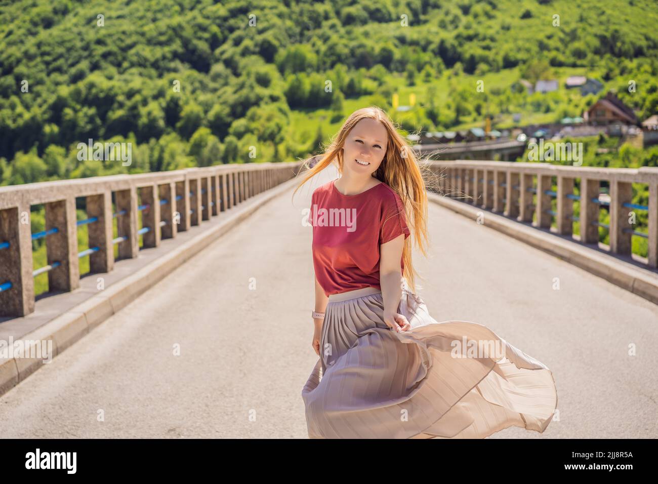 Montenegro. Woman tourist in background of Dzhurdzhevich Bridge Over ...