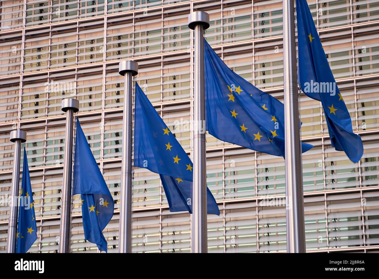 European Union EU flags waving in front of the European Commission ...