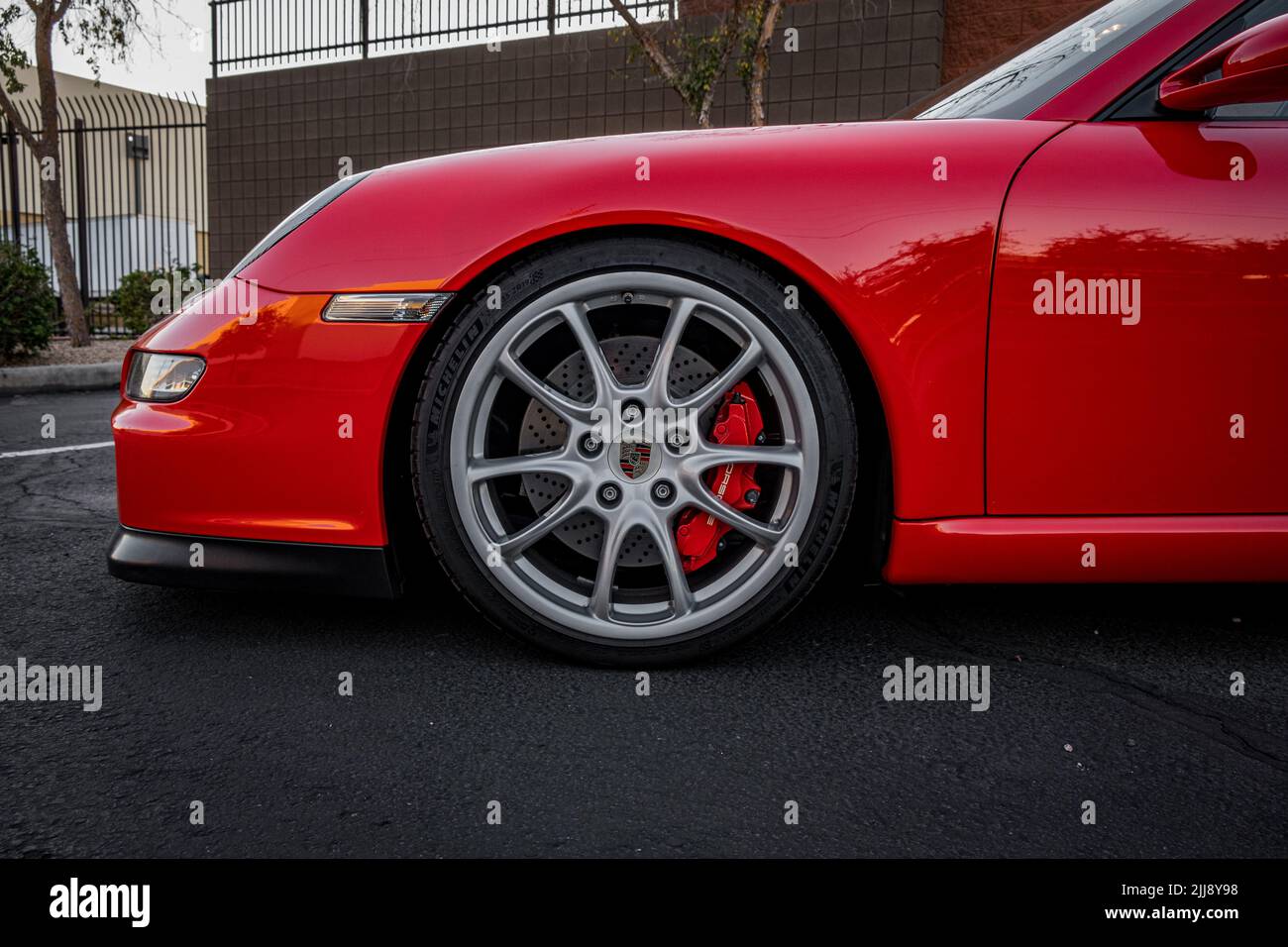 A close-up shot of a Red 2008 Porsche 911 GT3 tire Stock Photo - Alamy