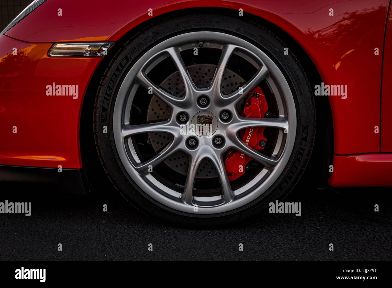 A close-up shot of a Red 2008 Porsche 911 GT3 tire Stock Photo - Alamy