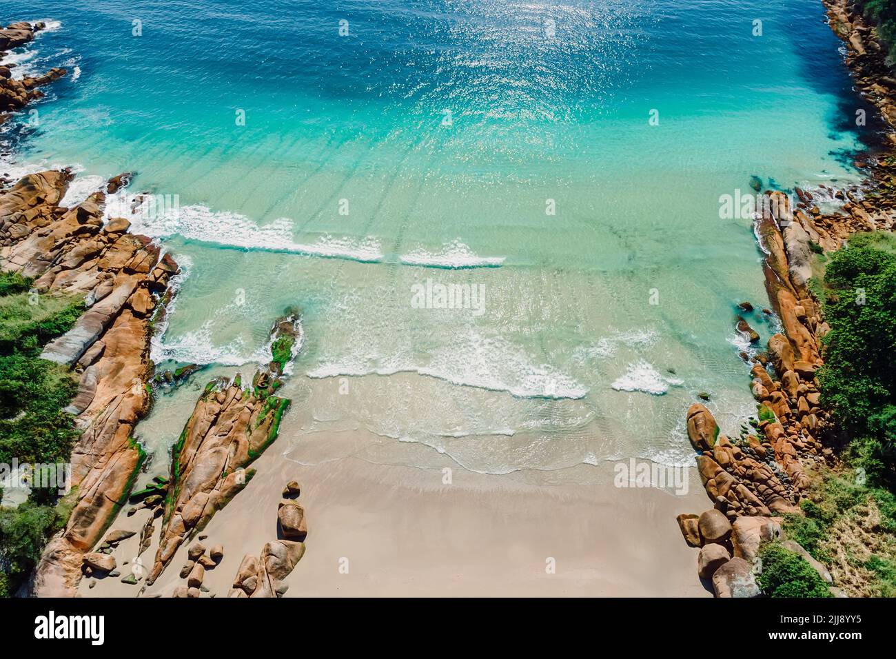 Beach, rocks and transparent blue ocean in Brazil. Aerial view of ...