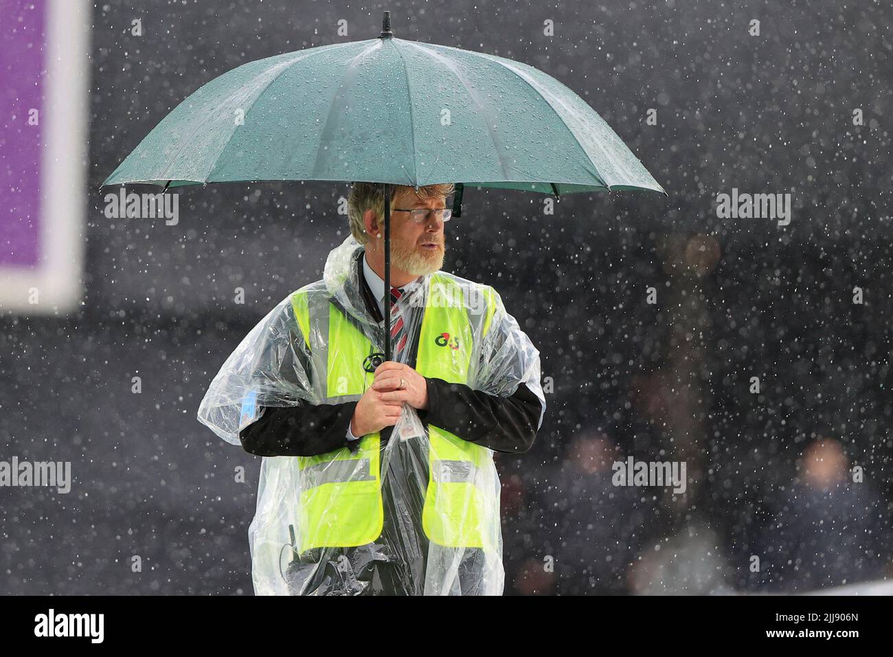 Security staff member guarding the wicket at a rain soaked Headingley ...